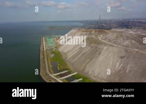 Aerial of metallurgical plants slag, scrap dump heap from metallurgical ...