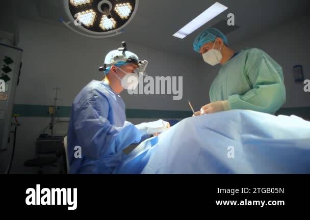 KYIV, UKRAINE - MAY 25, 2022: The neurosurgeon performs ventriculo ...