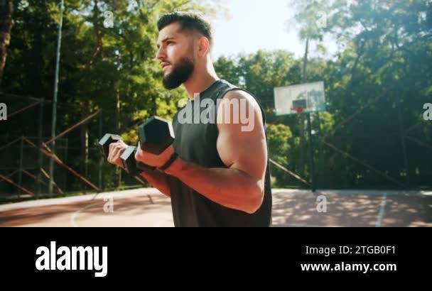 Fit man working out with dumbbells. Gym concept. Healthy lifestyle ...