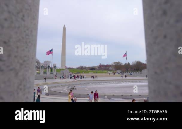 Tourists visit the World War II Memorial on the National Mall in ...