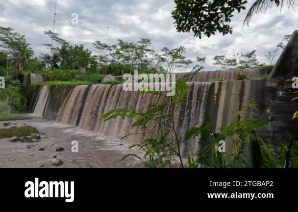 The view at a waterfall whose water is cloudy because it carries mud ...