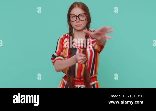 Mime redhead girl pulling an imaginary unreal invisible rope, puts lot ...