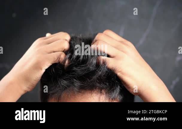 teenage boy Scratching Head Against black background Stock Video ...