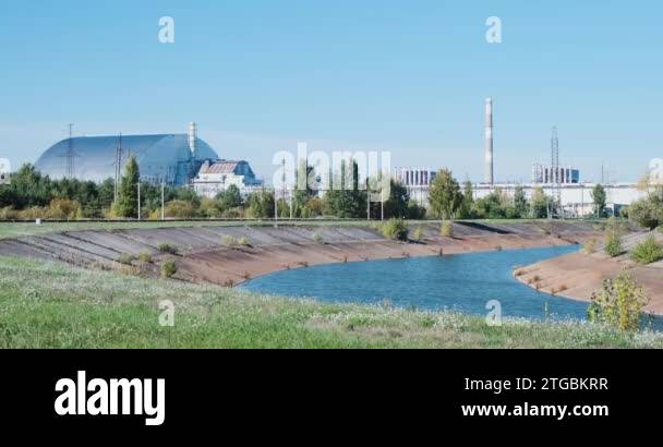 huge hangar, a factory, a nuclear power plant, pipes, a water cooling ...