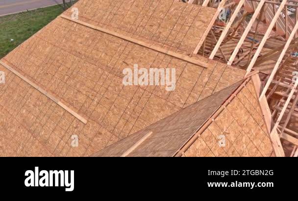 Newly built wooden skeleton frame of house roof section view in ...