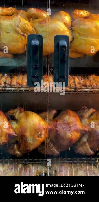 Rotating delicious grilled whole chicken and turkey on electric grill ...