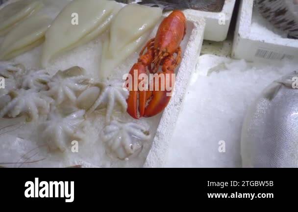 Fresh seafood market in Batumi Georgia. Live fish in ice. Flounder, red ...