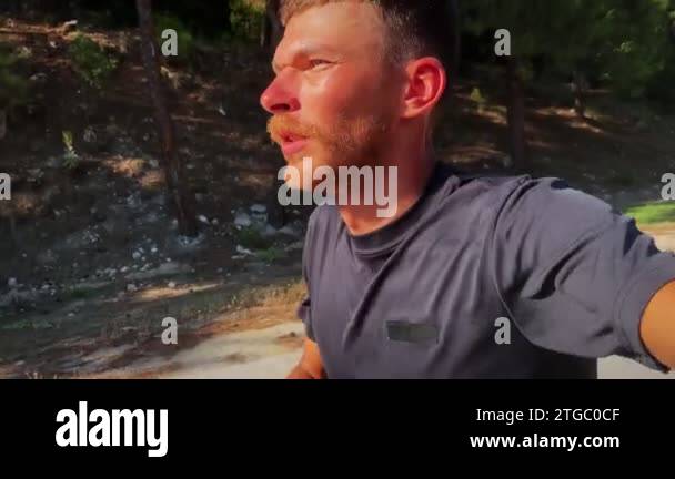 Man selfie while running at sunny summer day. Portrait of perspiring ...