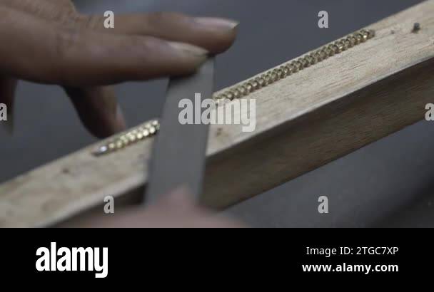 Jakarta, Indonesia-June 19, 2022: Gold craftsmen are smoothing the ...