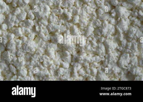 Cottage cheese of background, top view, rotates. White grainy texture ...