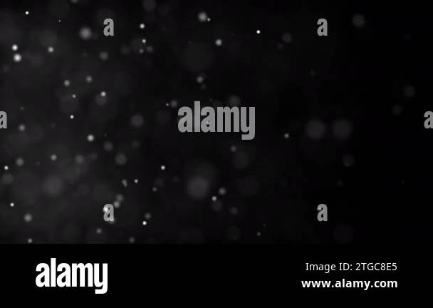 Abstract loop dust particles glow floating to top right on black ...