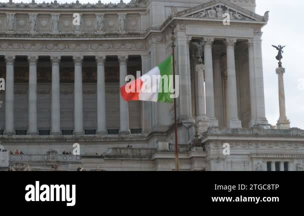 Italian flag waving on famous national monument in Rome,republic of ...