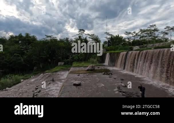 The view at a waterfall whose water is cloudy because it carries mud ...