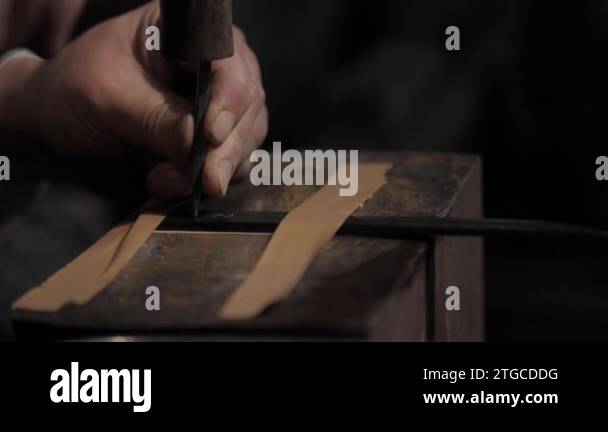 Carving a name into a metal blade of a Japanese katana samurai sword ...