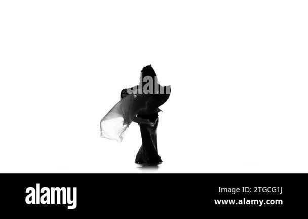 Beautiful exotic belly dancer woman, shaking her hips, uses fans, on ...