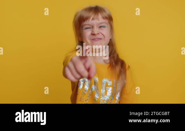 Amused young preteen child girl kid pointing finger to camera, laughing ...