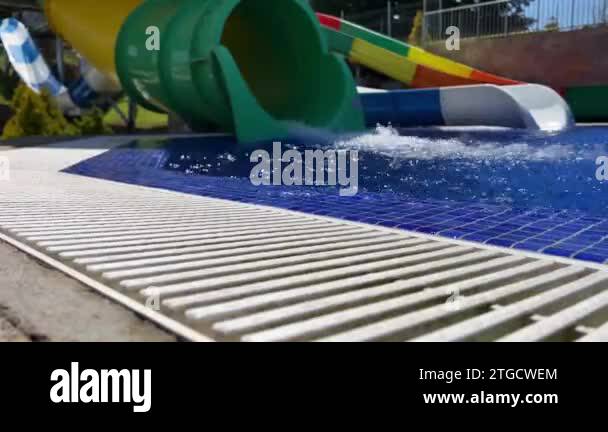 closeup exit of colored plastic water slides tubes in aqua park outdoor ...