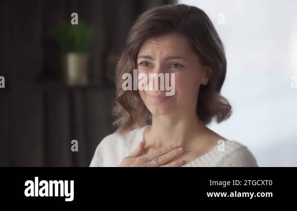 The young woman is embarrassed and ashamed, she repents and regrets ...