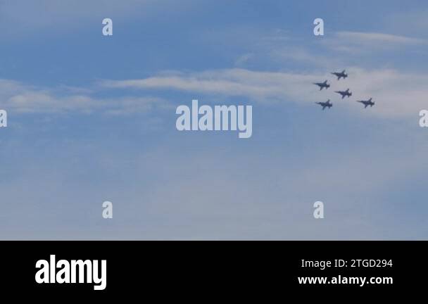 Isolated formation of military jets in flight with a single fast plane ...