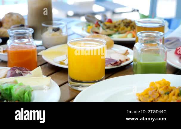 Breakfast at hotel or resort restaurant concept. Table with served food ...