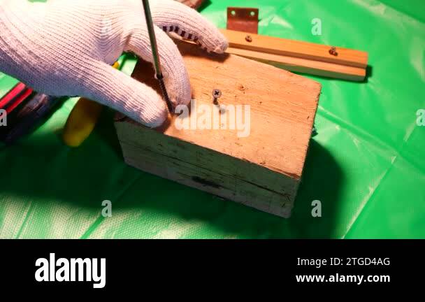 twisting with a screwdriver. Working tools.Screwdriver and screws. work ...