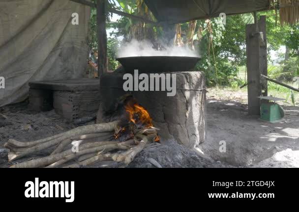 Khmer traditional sugar palm makers. Wok cooking on open wood burning ...