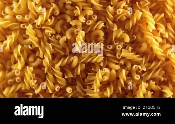 Uncooked Fusilli and Chifferi Rigati Pasta - Top View, Low Key Light ...