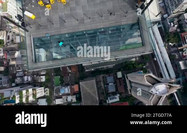 Employees clean the glass floor and prepare the viewing area for ...