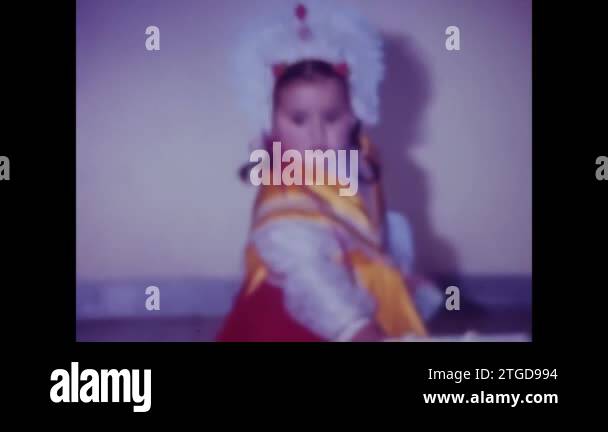 Palermo, Italy February 1970: children playing for carnival disguised as cartoon characters in ...