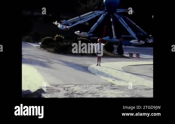 palermo, italy march 1970 : child under the carousel at the amusement park in the 70s Stock ...