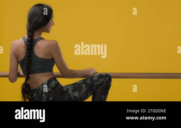 Back view from behind flexible graceful Indian slim sporty woman ethnic ...