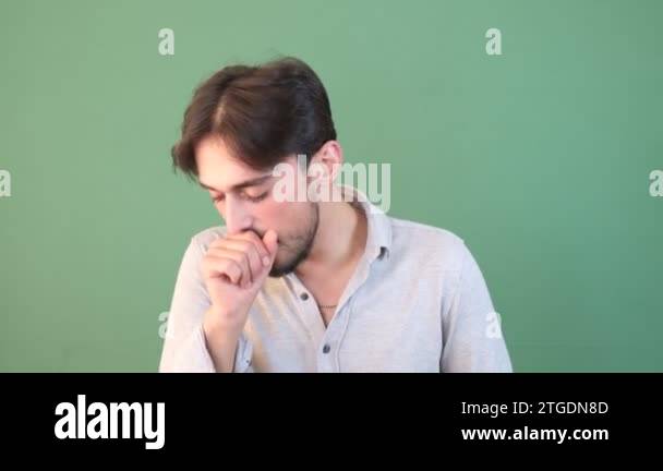 Man covering his mouth with his hand is coughing green screen, sick man ...