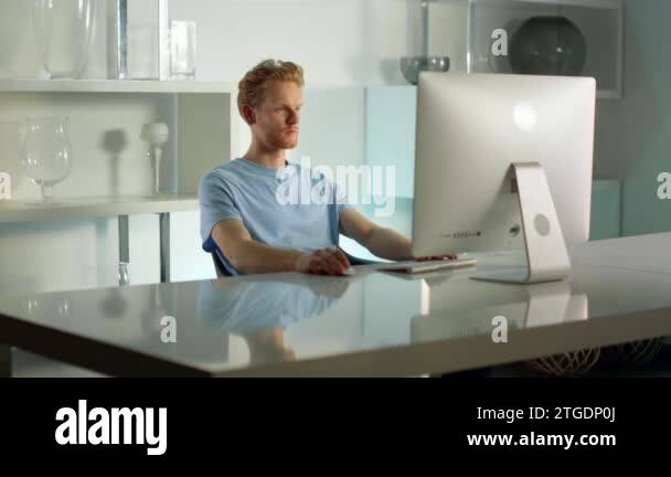 Corporate worker looking computer screen at home. IT manager typing ...