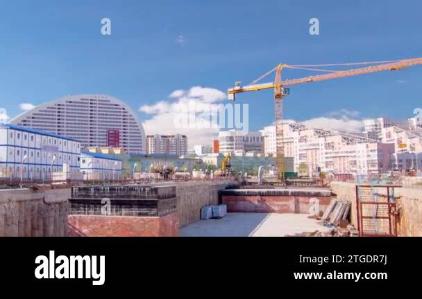 Crane on a large huge ditch pit tunnel timelapse. Reinforcing ...