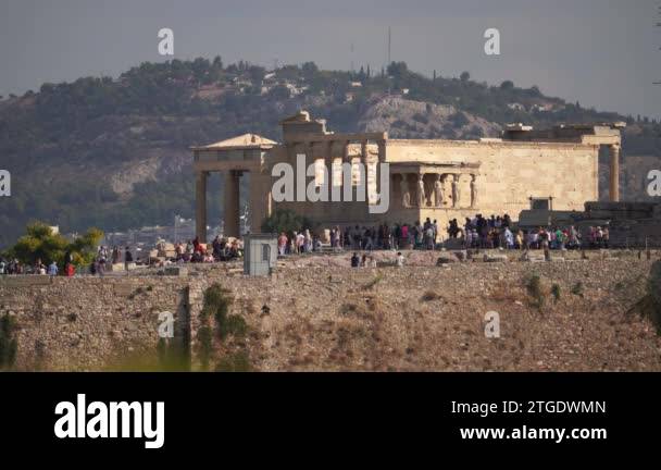 Acropolis of Athens, Greece. Many tourists in the Parthenon Temple ...