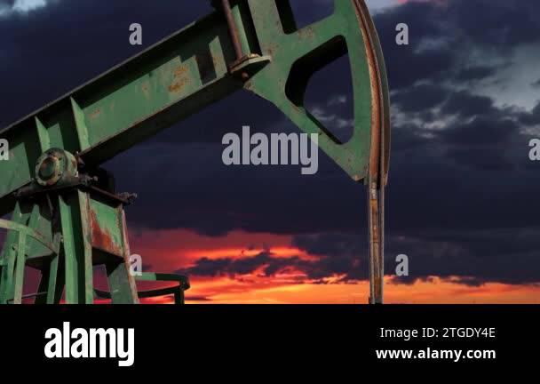 Oil Pumpjack Working Under A Dramatic Sky. Fossil Fuel Energy. Oil ...