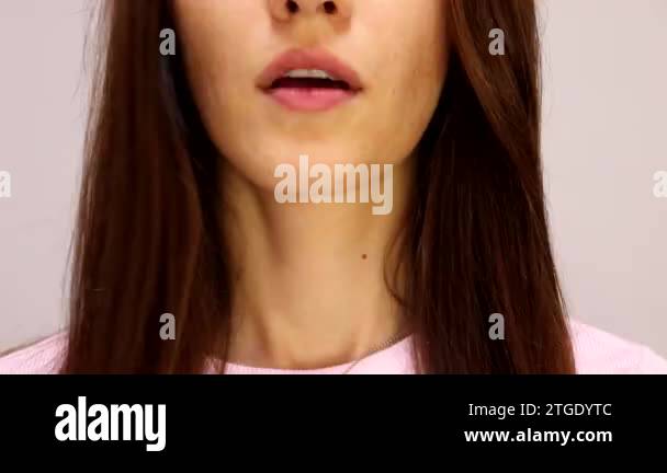 Woman shows large swollen tongue. Allergic reaction with Quinckes edema ...