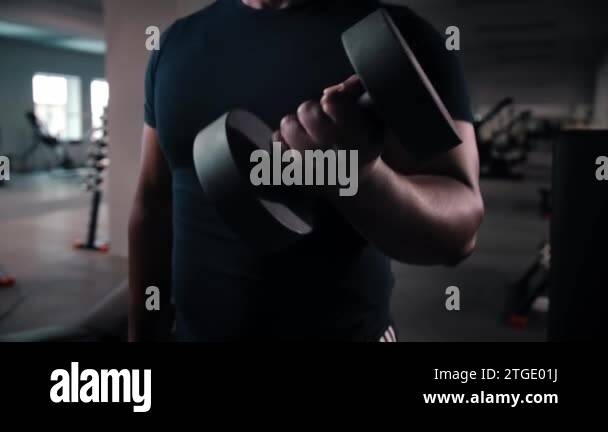 Black man workout with dumbbell training arms in gym.Bodybuilder ...