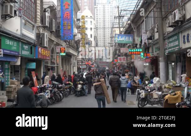 A bustling busy crowded street in downtown Shanghai in daytime. Many ...