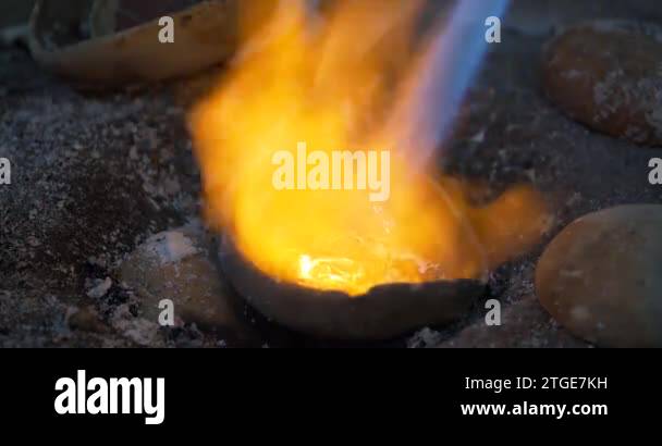 Jakarta, Indonesia-June 19, 2022: Traditional gold craftsmen melt gold ...