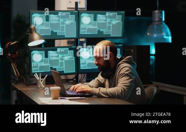 Cyber criminal celebrating hacking success in office at night, working ...