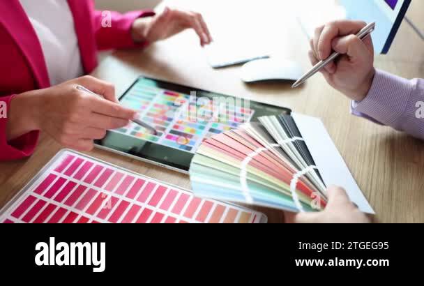 Designer with client chooses color on color palette. Choice of color ...
