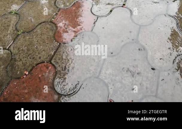 Rain marks on paving slabs Stock Video Footage - Alamy