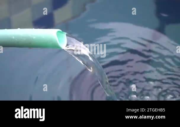 footage of water dripping down the pool from a plastic hose Stock Video ...