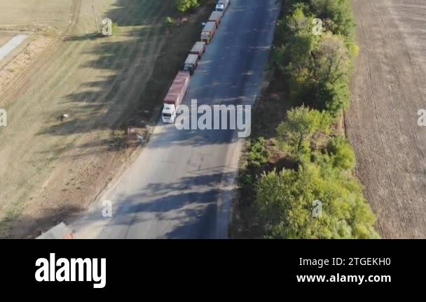 grain delivery. Grain storage. Grain trucks stand along the road in ...