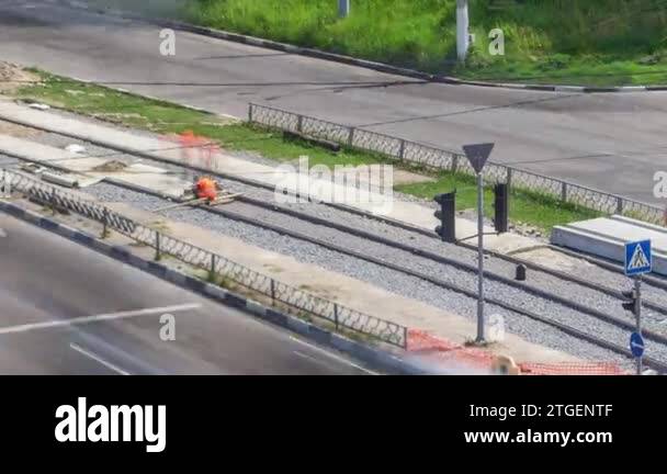 Repair works on the street aerial timelapse. Laying of new tram rails ...