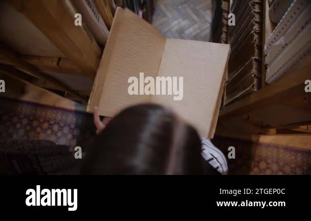 Blind woman reading braille book top view, poorly seeing female person ...