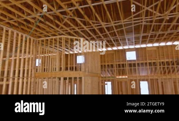 An interior view of a wooden building the beam framework is supported ...