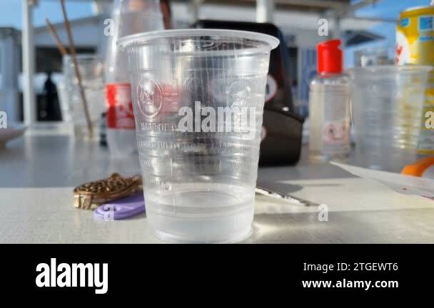 Single use Beverage plastic cup used on a restaurant table,disposable ...