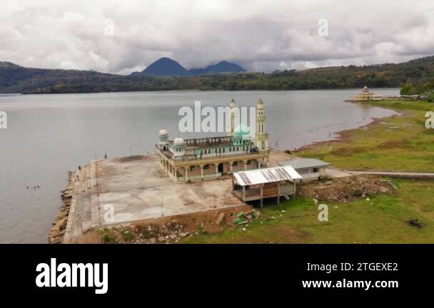 Mosque with minarets and lake Lanao. Muslim region in the Philippines ...